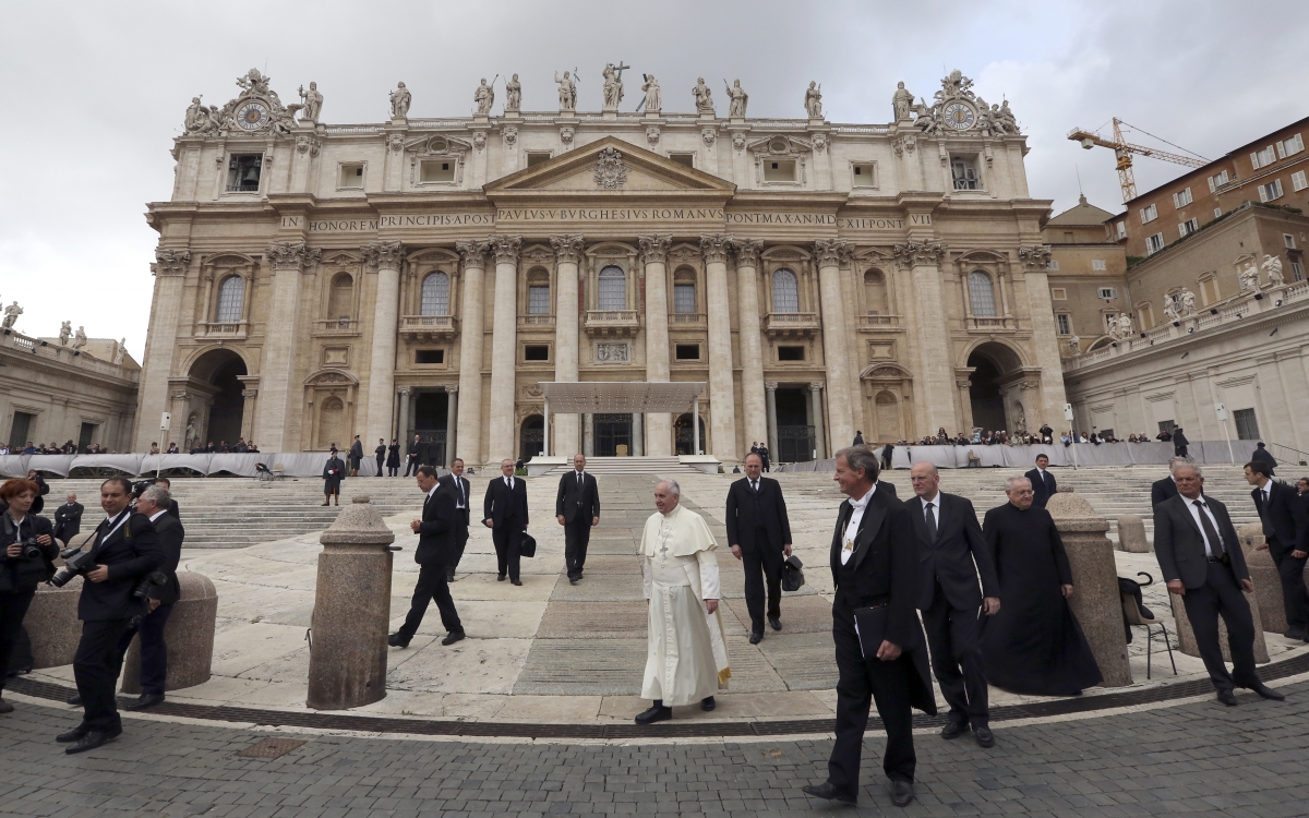 Topless Femen protesters deface crucifixes outside Vatican in lewd ...