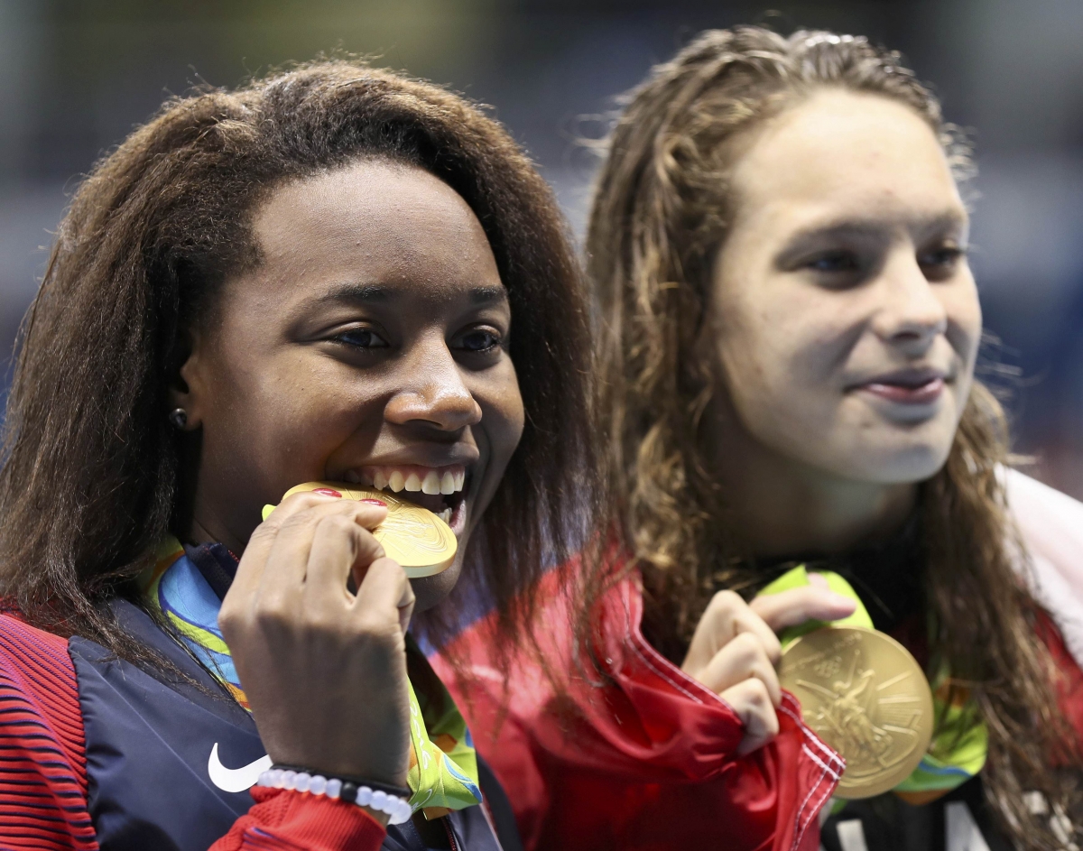 Christian swimmer wins gold, sets Olympic record and makes history ...